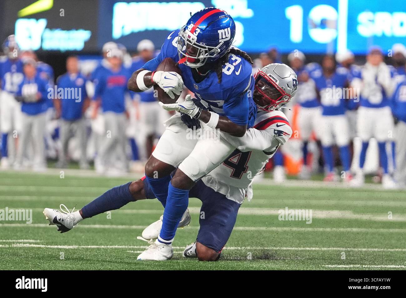New England Patriots safety Dell Pettus (24) tackles New York Giants ...