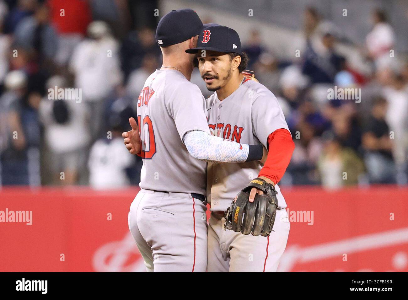 Boston Red Sox's Trevor Story, left, and David Hamilton, right, react ...
