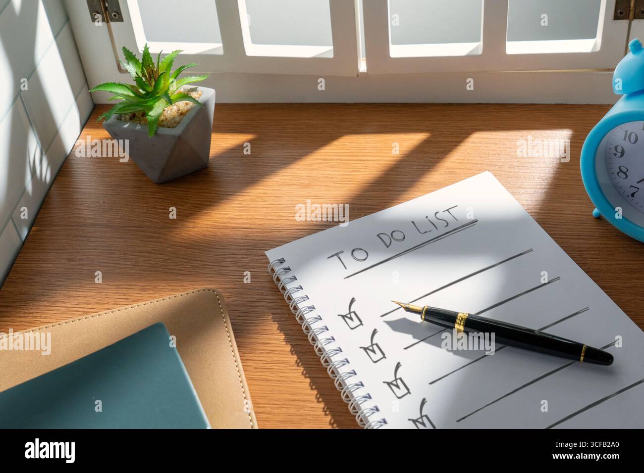 A notebook with "TO DO LIST" written on it. Productivity, time ...