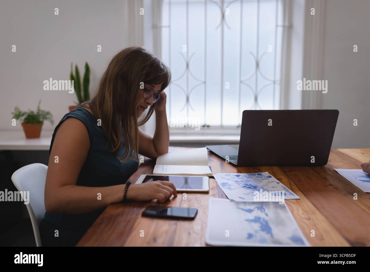 Woman tapping device swiping tablet hi-res stock photography and images ...