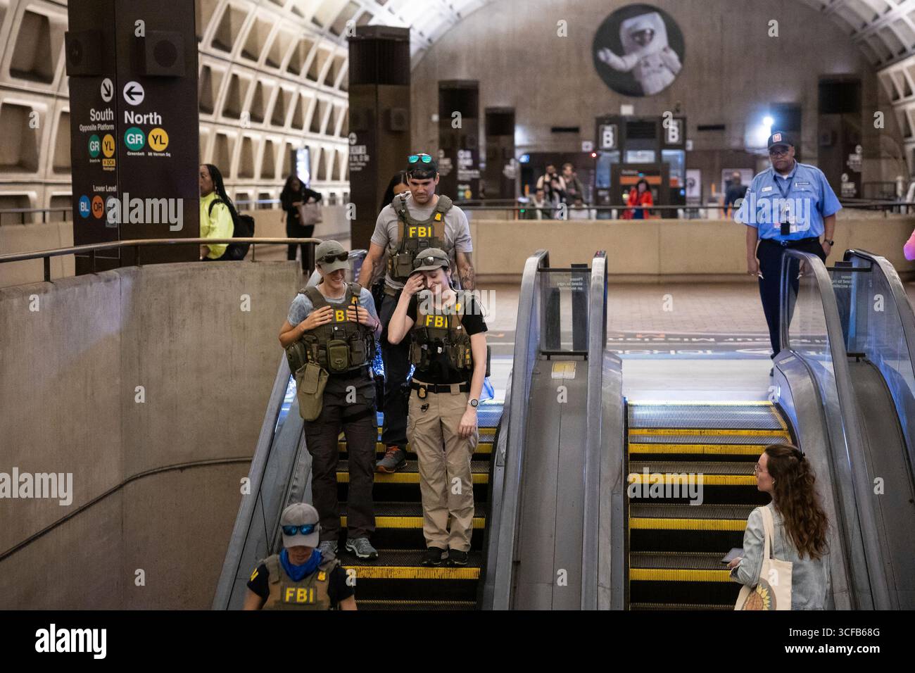 Federal Bureau of Investigation (FBI) agents are seen in the L'Enfant ...