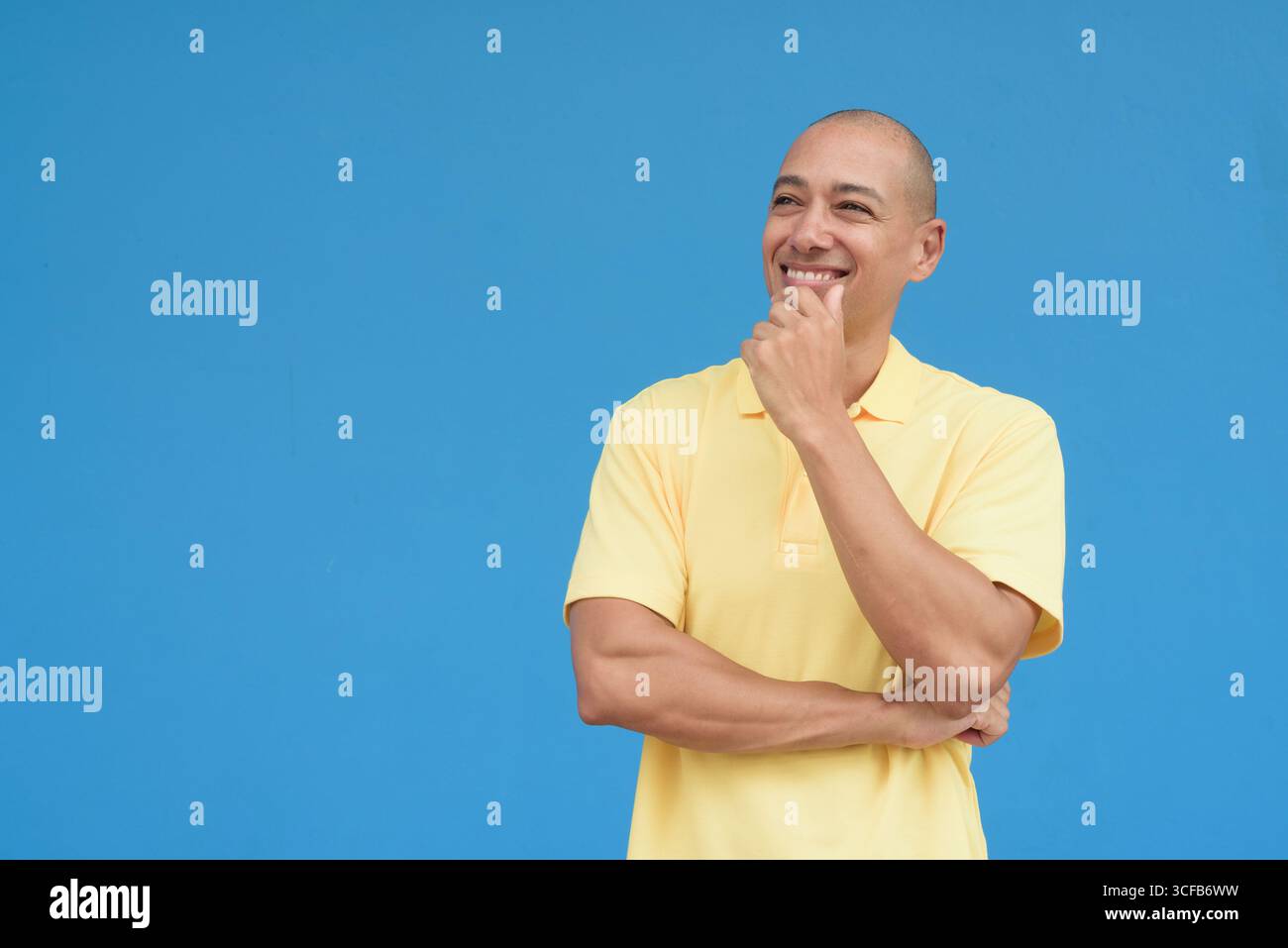 Studio portrait of a handsome mature Italian man with shaved head ...