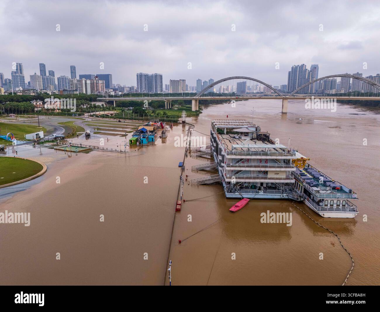 NANNING, CHINA - AUGUST 22, 2025 - The shops along the river at Tingzi ...