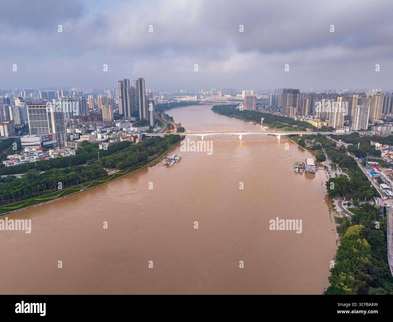 NANNING, CHINA - AUGUST 22, 2025 - The shops along the river at Tingzi ...