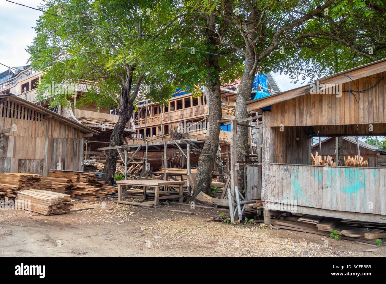 Wooden boats are built by hand at the Tana Beru shipyard in Sulawesi ...