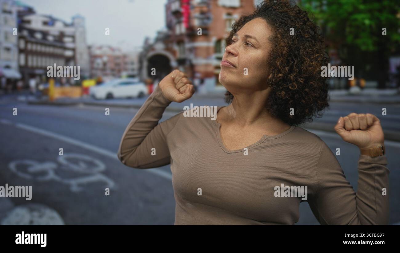Woman raises arms flex in hi-res stock photography and images - Alamy