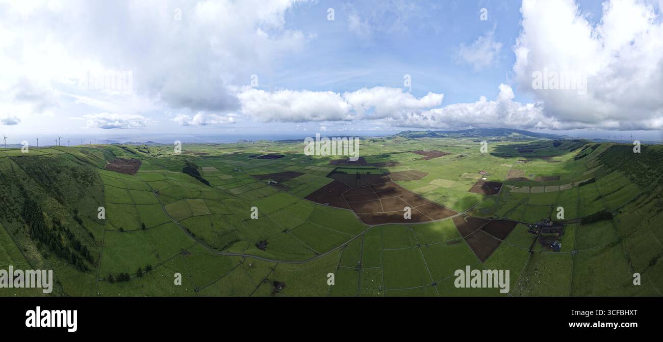 Aerial view of patchwork fields of vibrant green and rich brown meet ...
