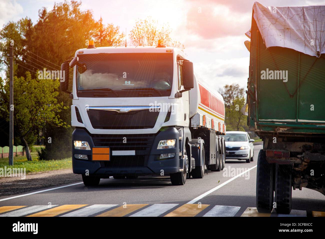 Modern truck with tank trailer transports dangerous cargo acetone and ...