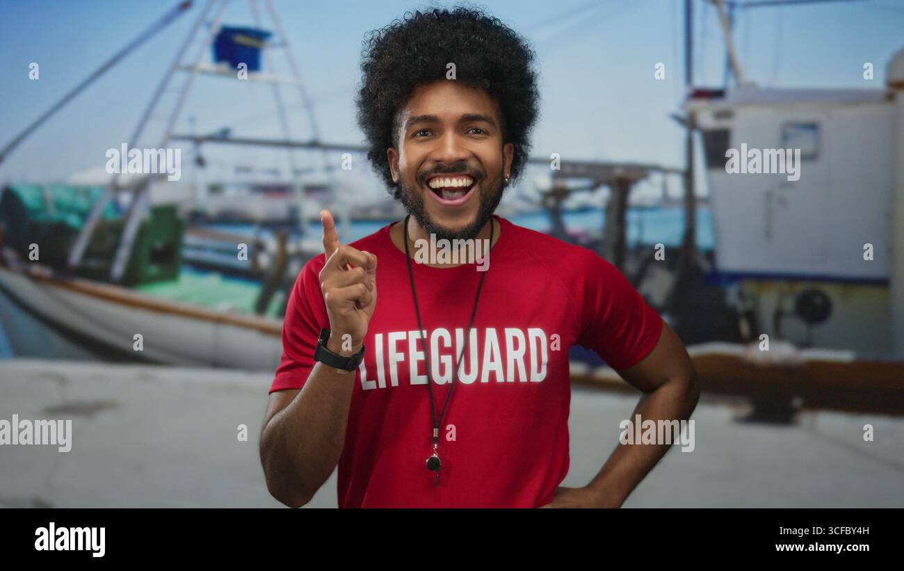 Smiling lifeguard man beard stands hi-res stock photography and images ...