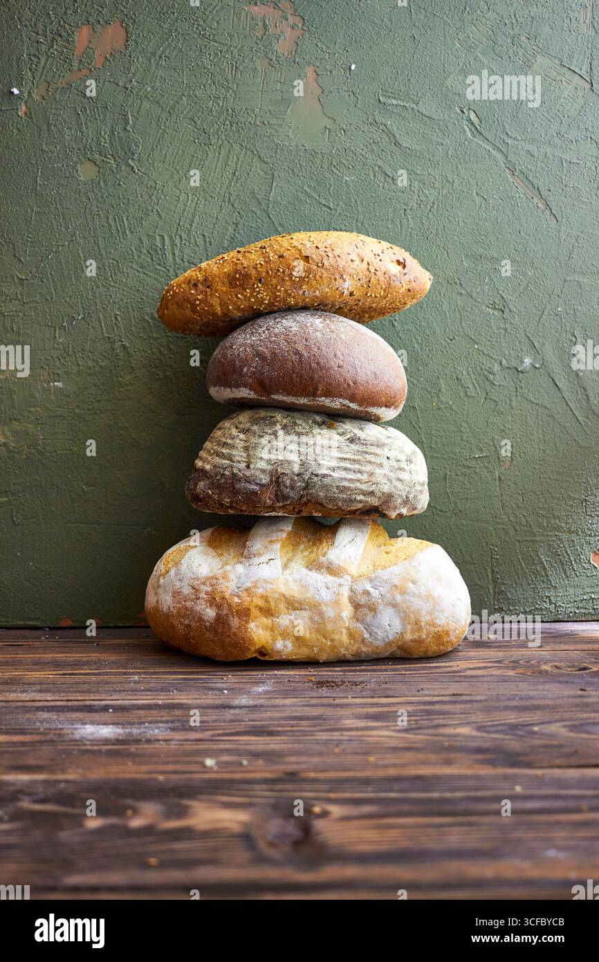 Rustic artisan bread series with whole loaves and sliced bread on ...