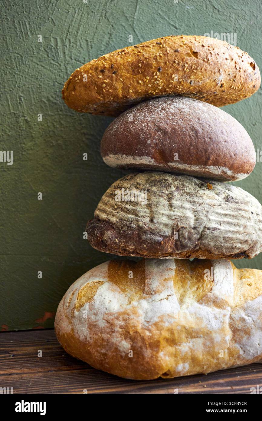 Rustic artisan bread series with whole loaves and sliced bread on ...