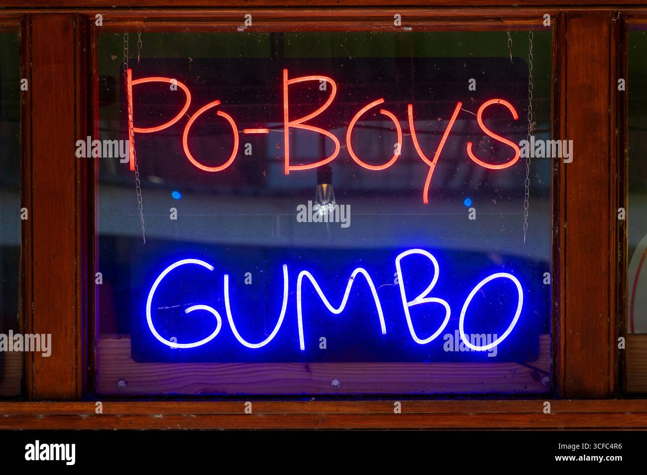 Po-Boys Gumbo neon sign at the window of a Cajun restaurant in New ...