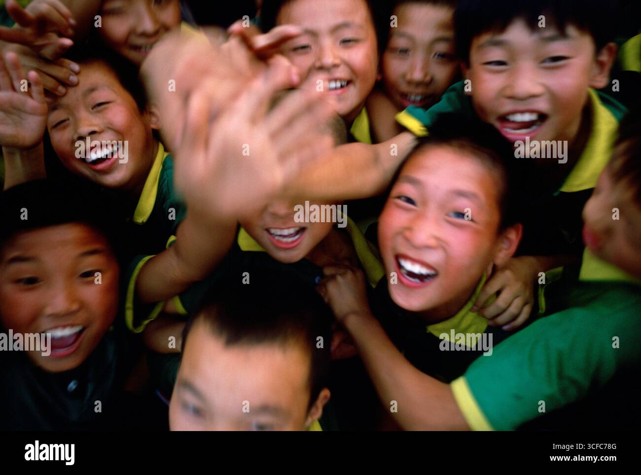 Chinese Shaolin kids take a break from training to wave to camera Stock ...