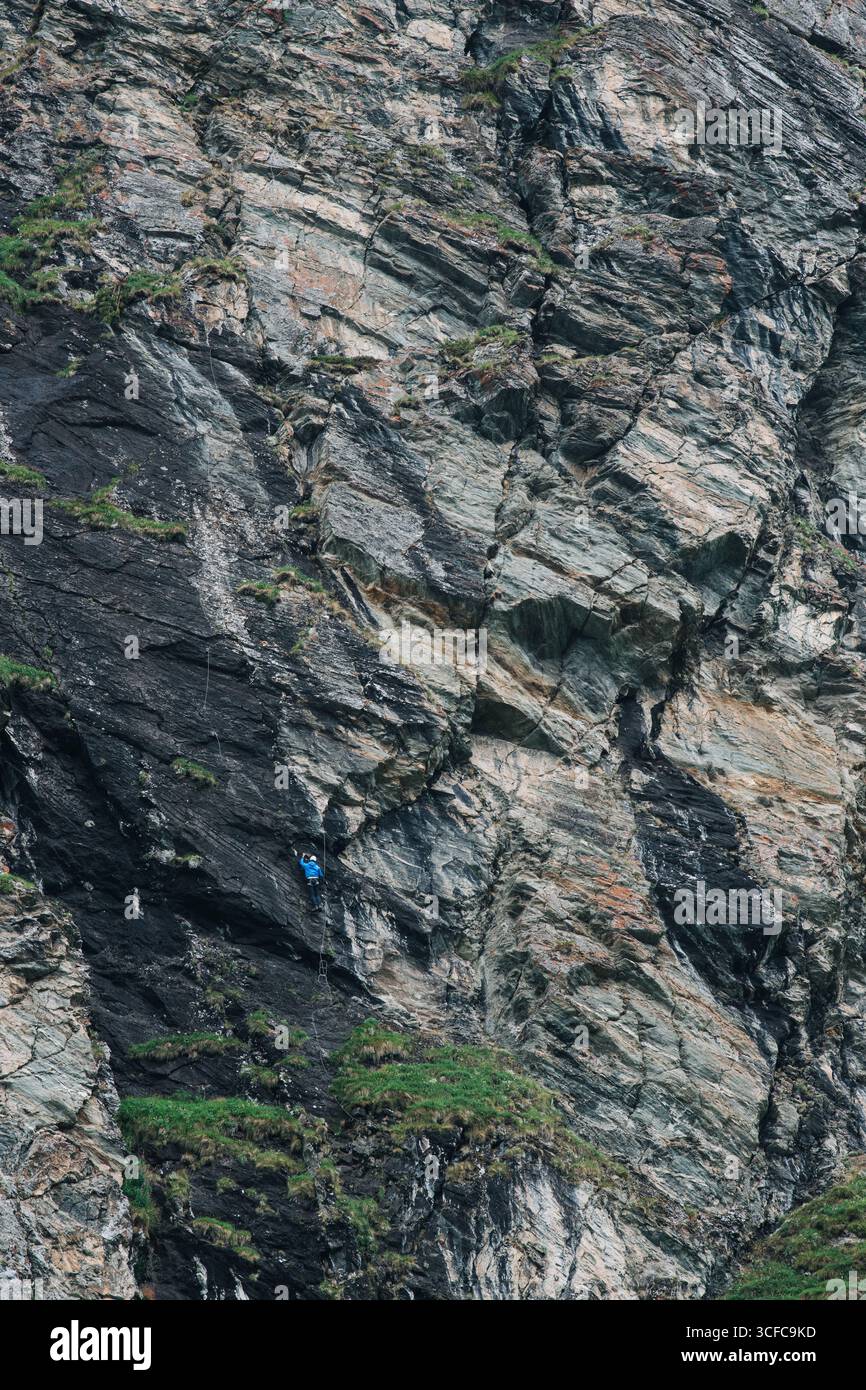man climbing via ferrata at Moiry Dam in Switzerland Stock Photo - Alamy
