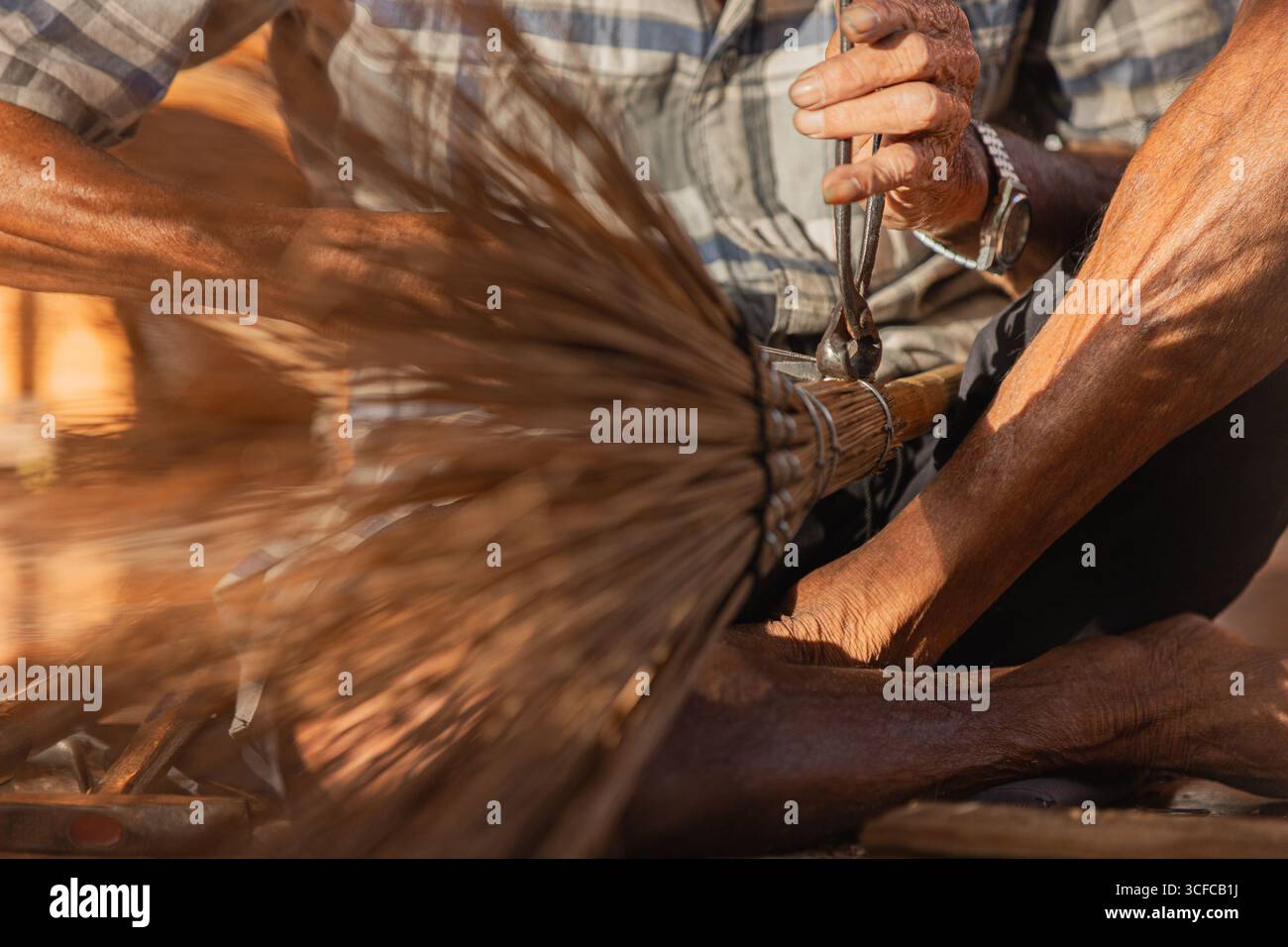 Straw broom broom in hands hi-res stock photography and images - Alamy