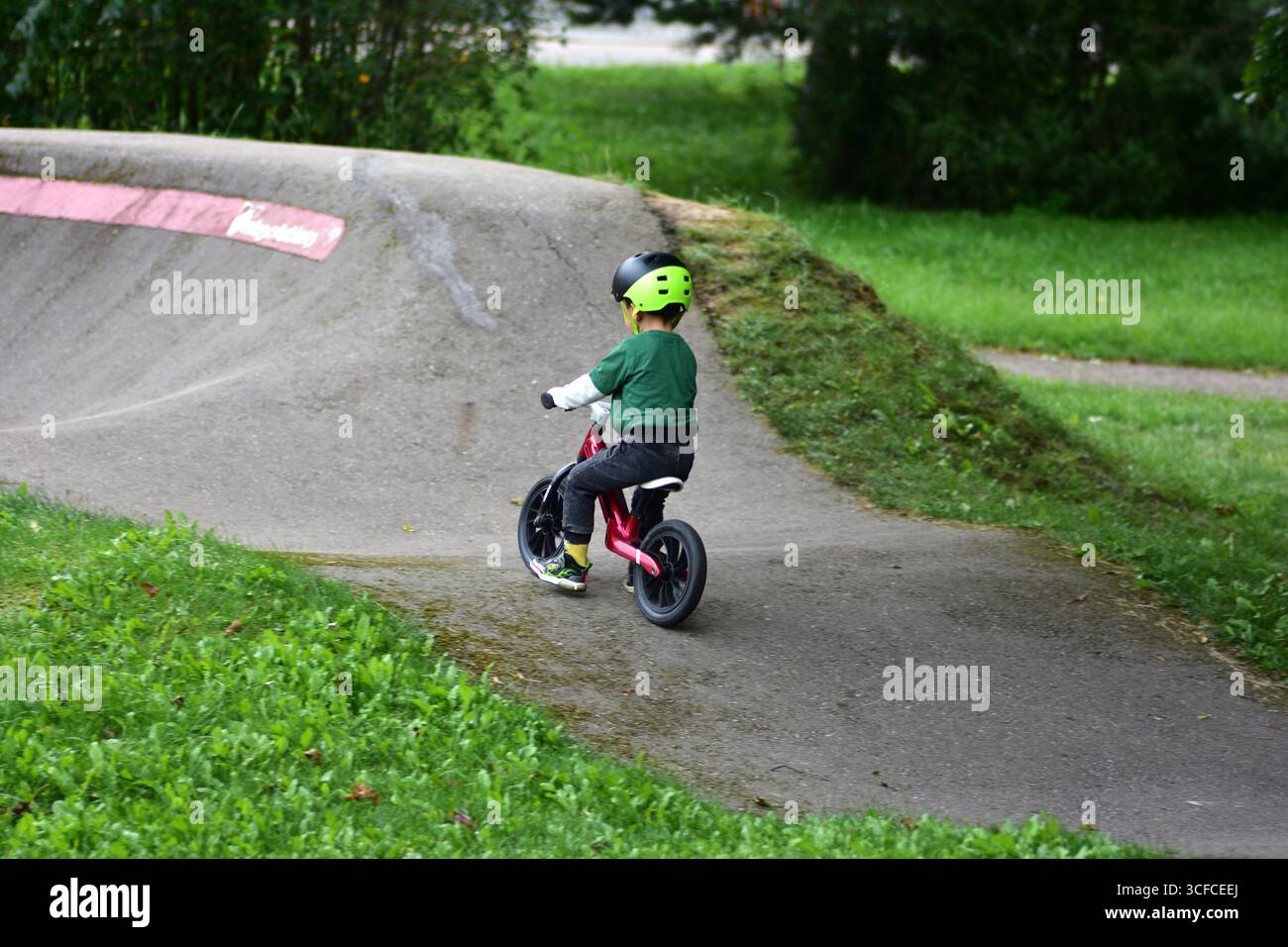 Child rides balance bike on hi-res stock photography and images - Alamy