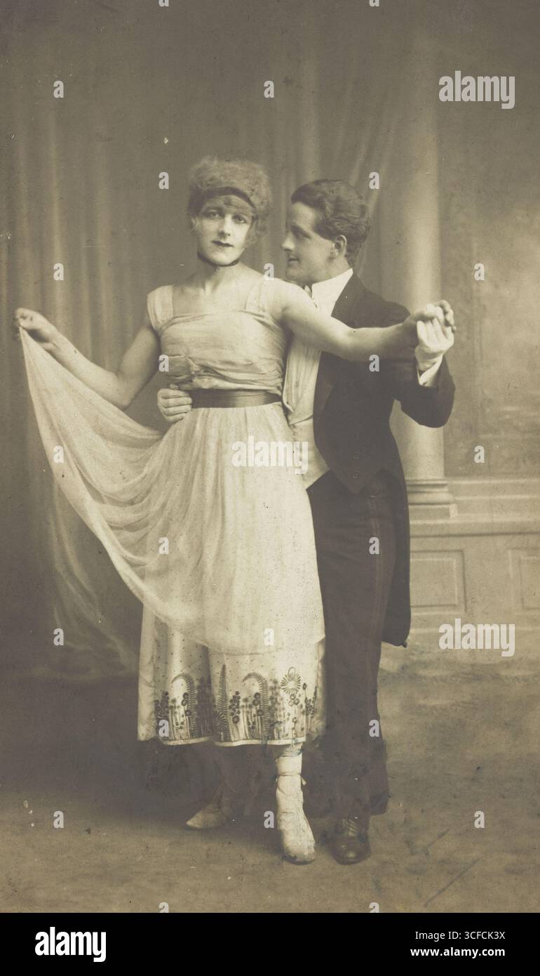 Two actors, one in drag, dancing together on stage, 1918 Stock Photo ...