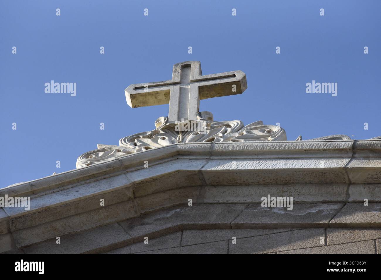 Antique hand carved marble cross on the rooftop of the Metropolitan ...