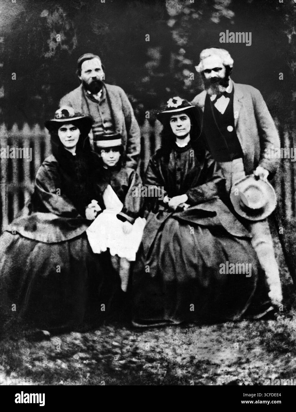 Karl Marx (l) with his three daughters, Jenny, Eleanor and Laura, and ...