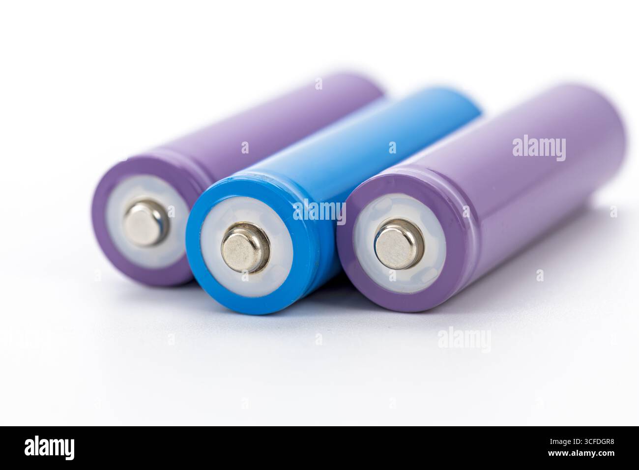 A purple and blue cylindrical rechargeable batteries arranged on white ...
