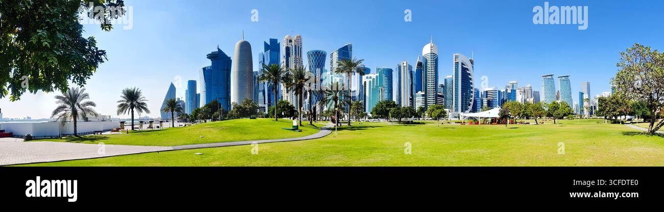 Tall modern skyscrapers tower over the central park in Doha Qatar Stock ...