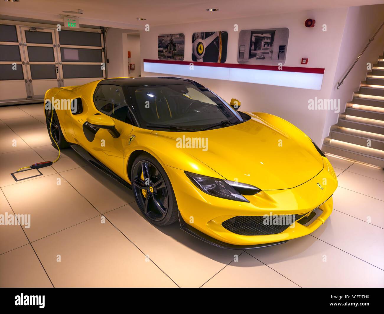 February 4, 2025, Qatar Doha. modern hybrid Ferrari car in the showroom ...