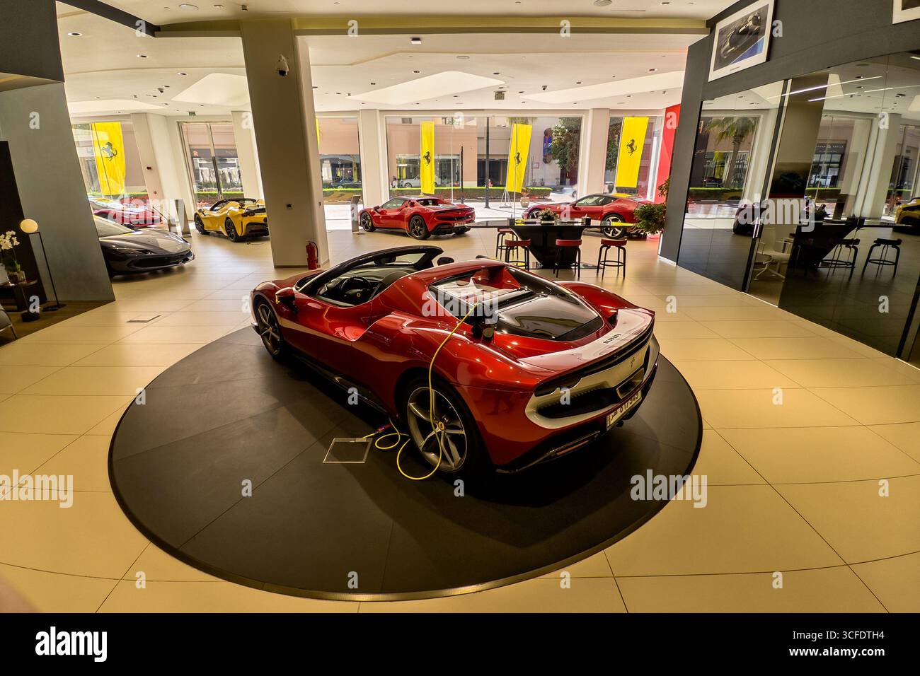 February 4, 2025, Qatar Doha. modern hybrid Ferrari car in the showroom ...