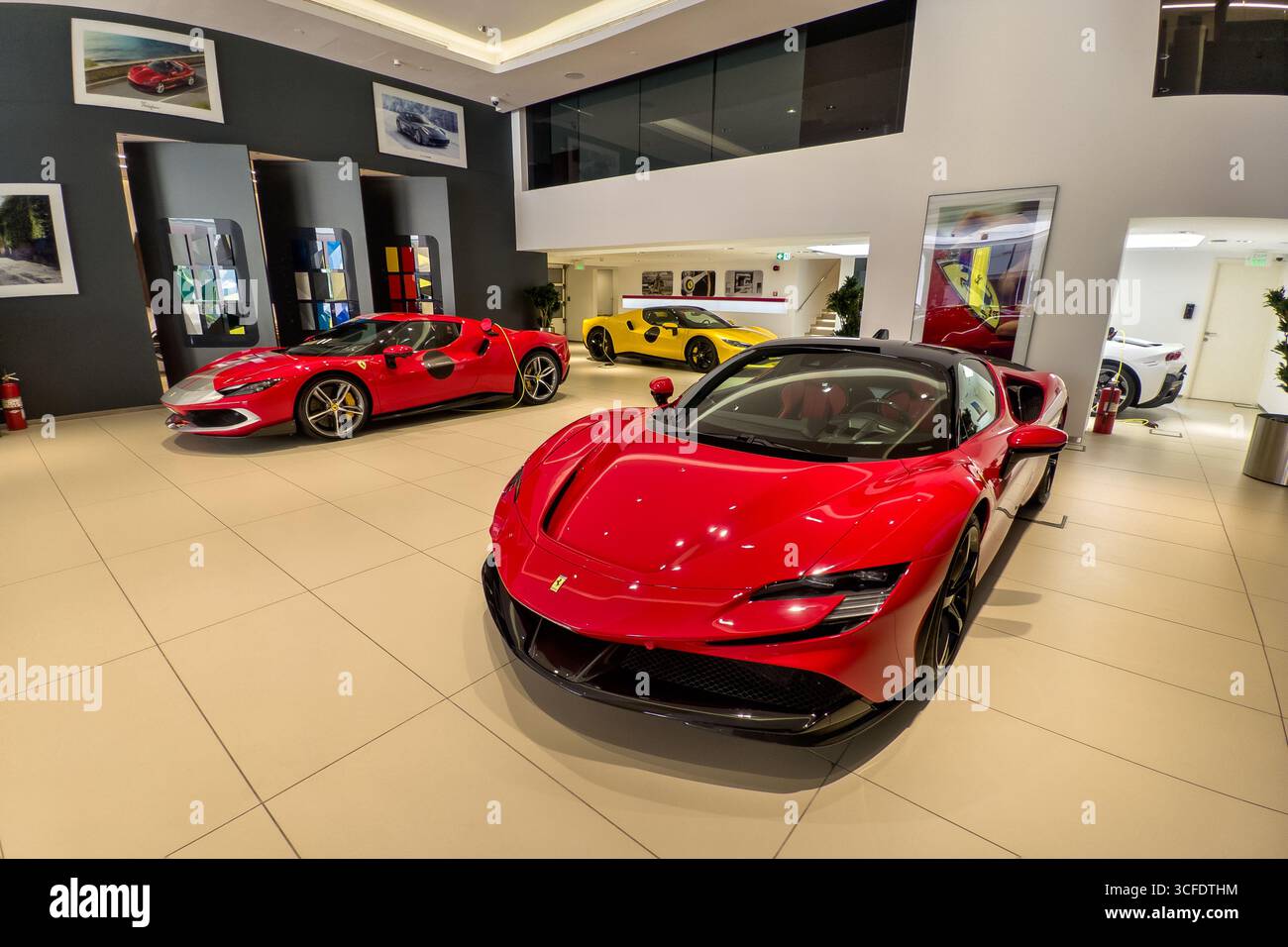 February 4, 2025, Qatar Doha. modern hybrid Ferrari car in the showroom ...