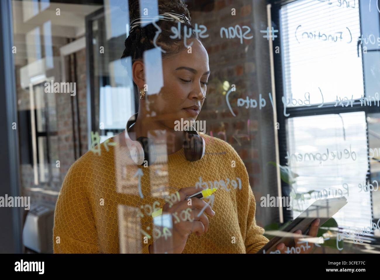 Focused software developer writing code hi-res stock photography and ...