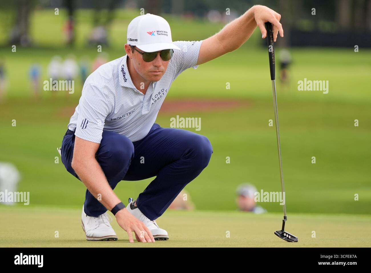 Ben Griffin lines up his putt on the third green during the second ...