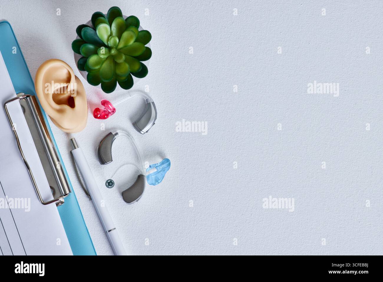 Audiology clinic displays modern hearing aids alongside an information ...