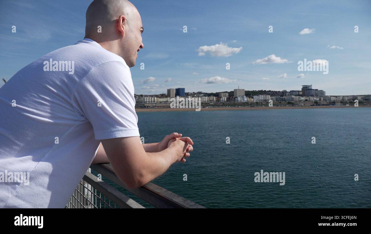 Dean Stokes looks out to sea on Brighton Pier in East Sussex. Mr Stokes ...