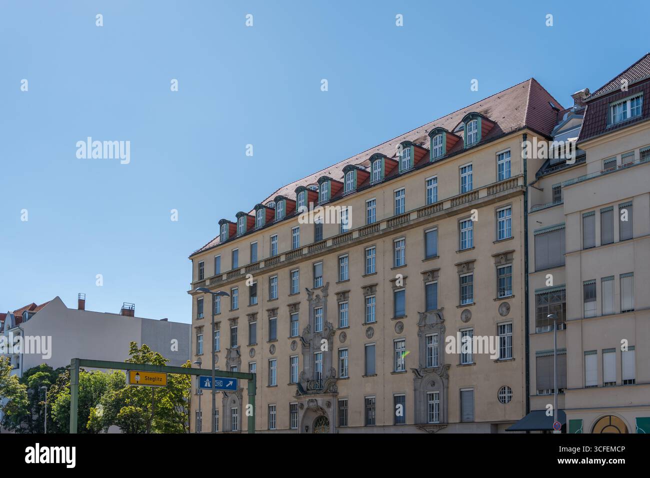 A classic Berlin residential building with dormer windows and ornate ...