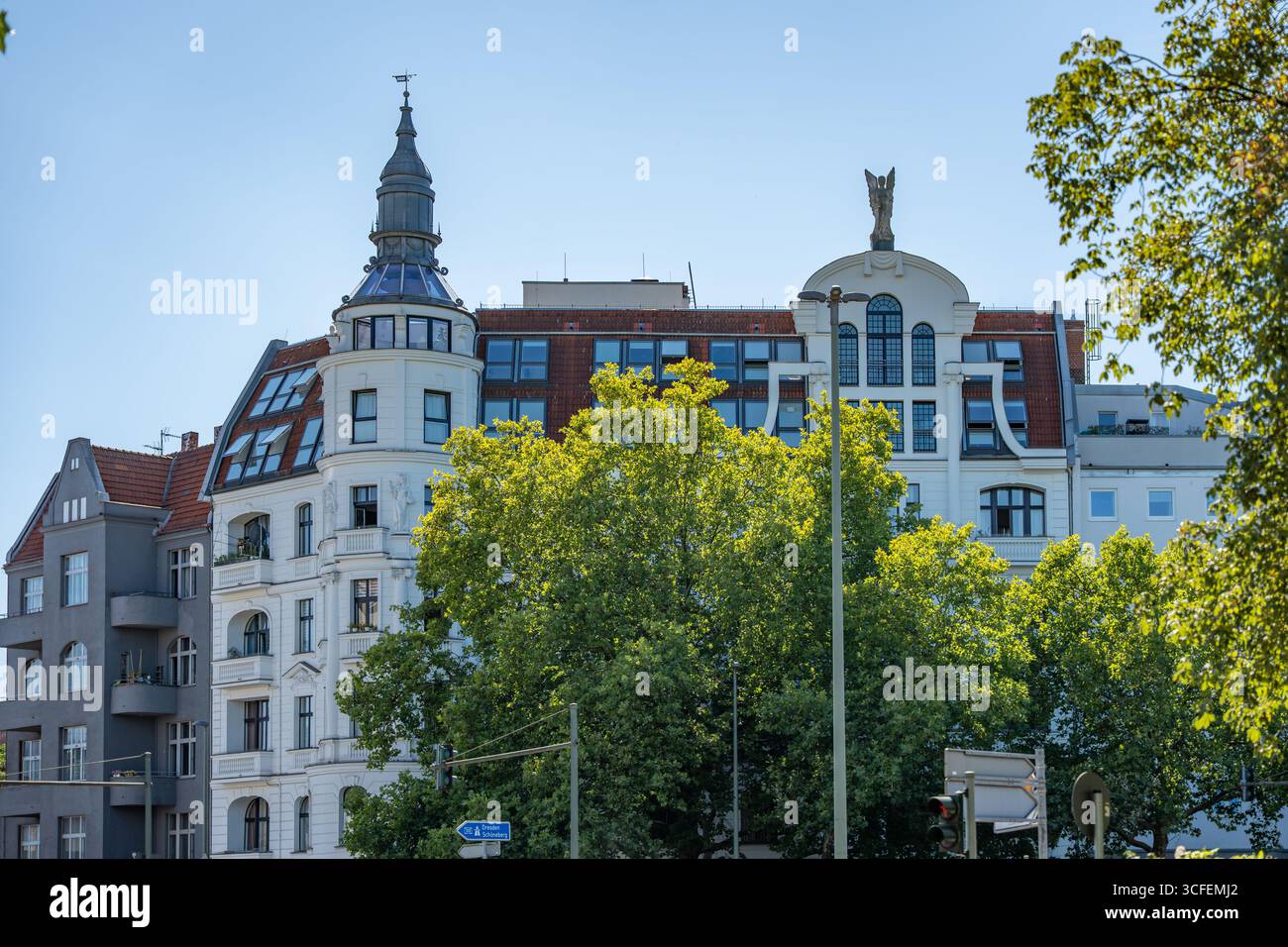 Historic corner building with a tower and modern roof design in Berlin ...