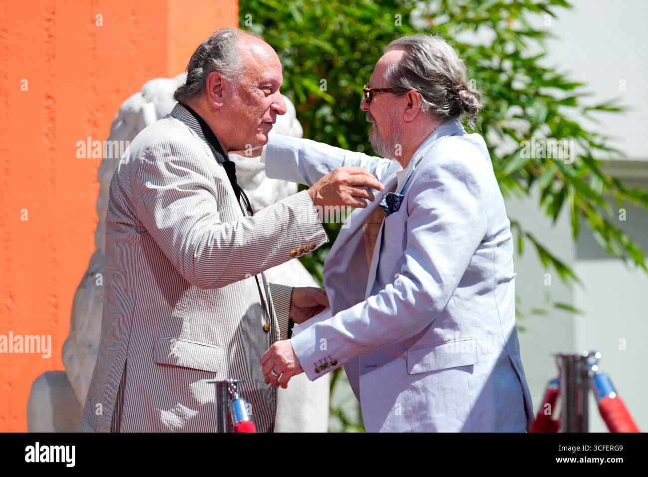 Douglas Urbanski, left, and Gary Oldman greet each other during a hand ...