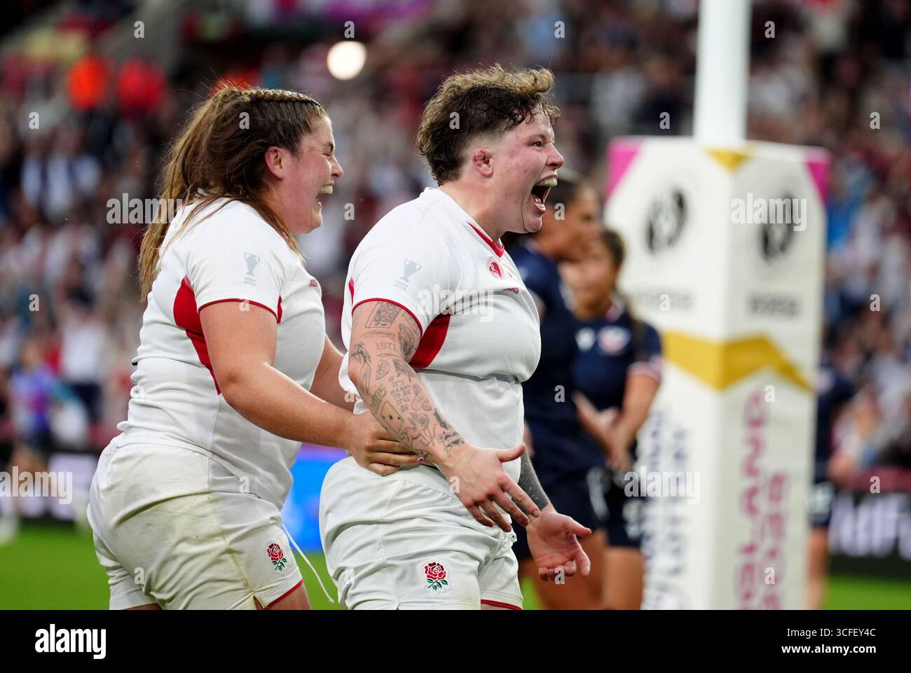 England's Hannah Botterman (right) celebrates after scoring her sides ...