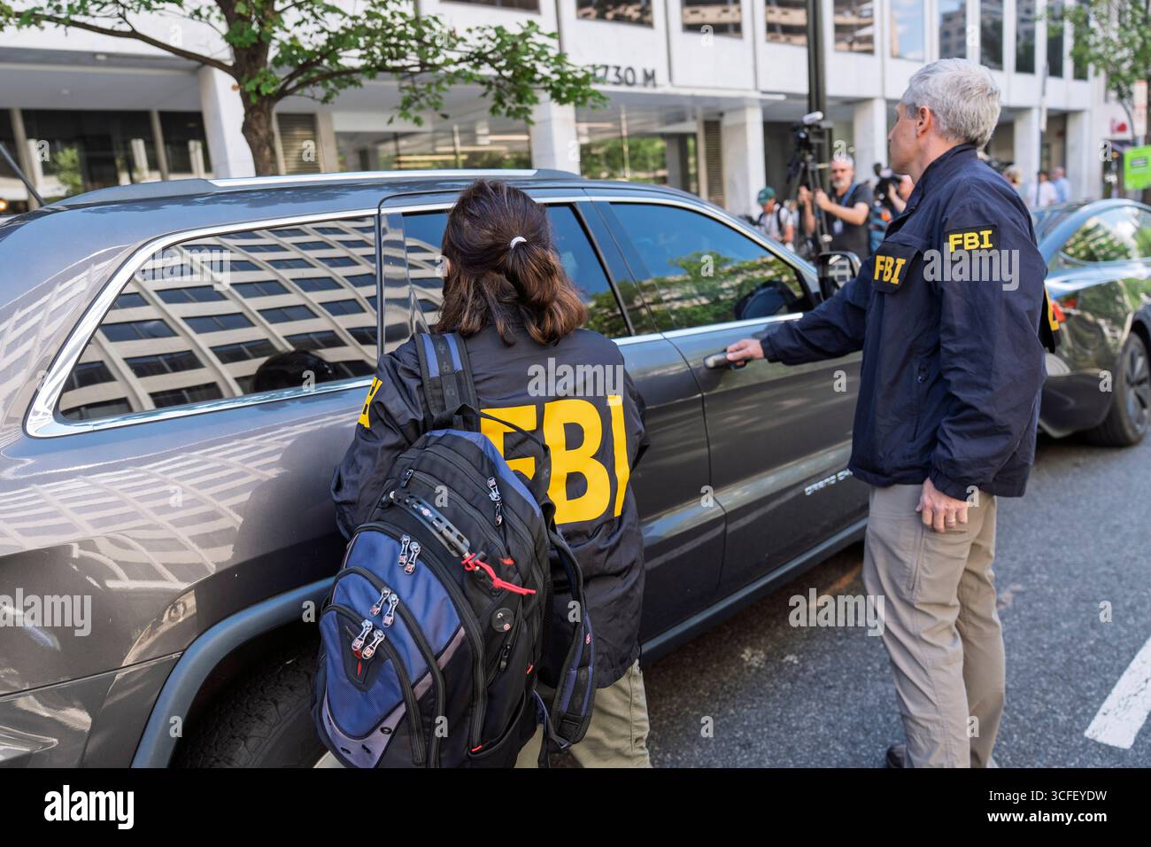 FBI agents depart the office of former National Security Advisor John ...