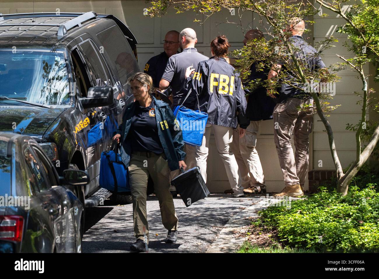 FBI agents leave the house of former national security adviser John ...