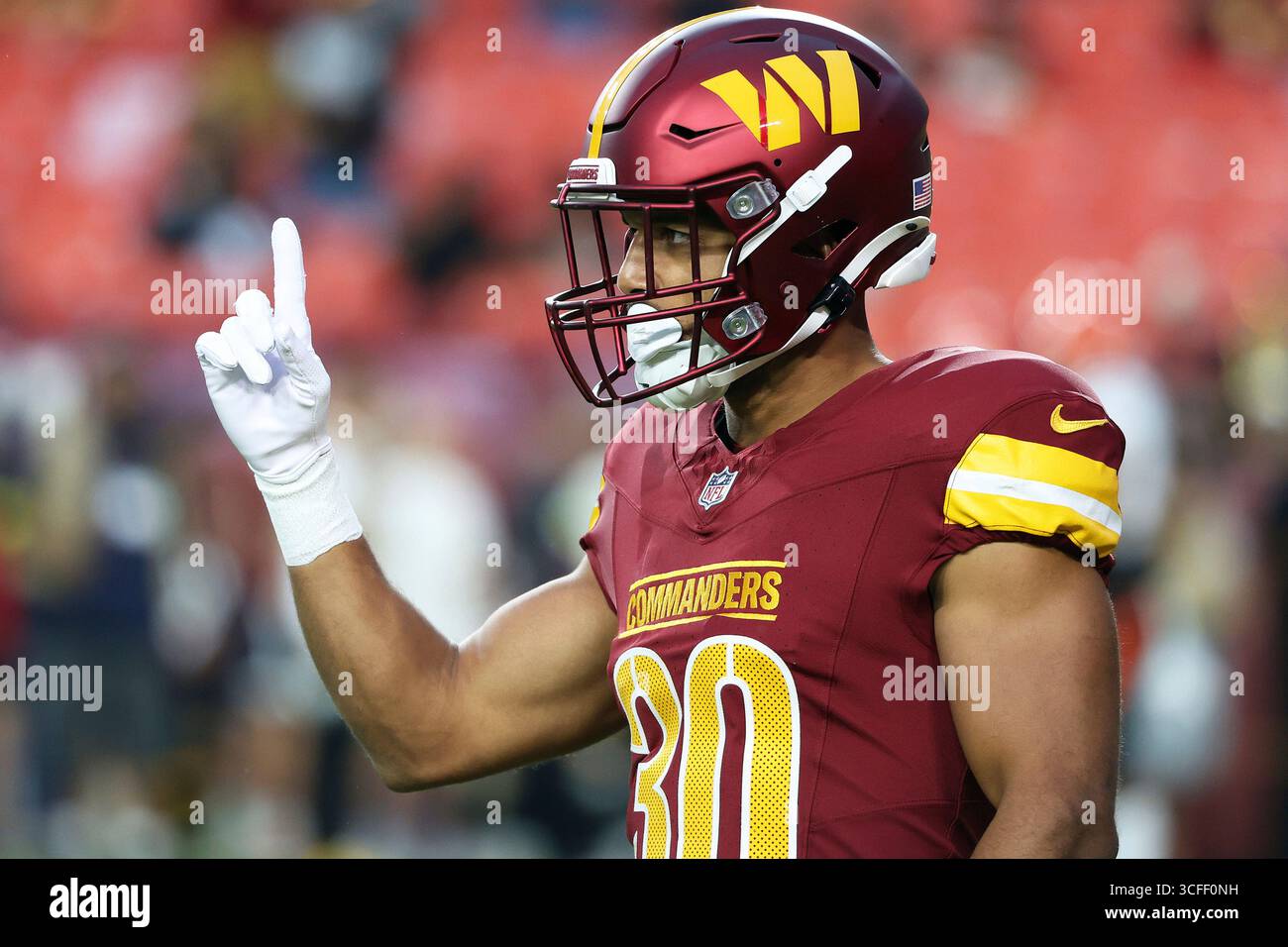 Washington Commanders running back Austin Ekeler (30) looks on before ...
