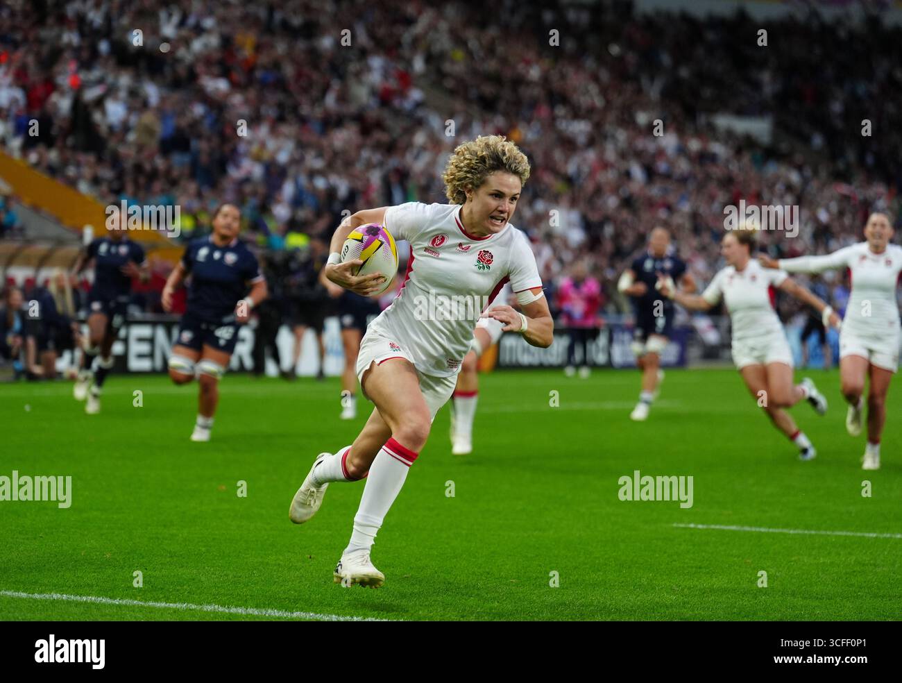 England's Ellie Kildunne runs in to score her sides fourth try during ...