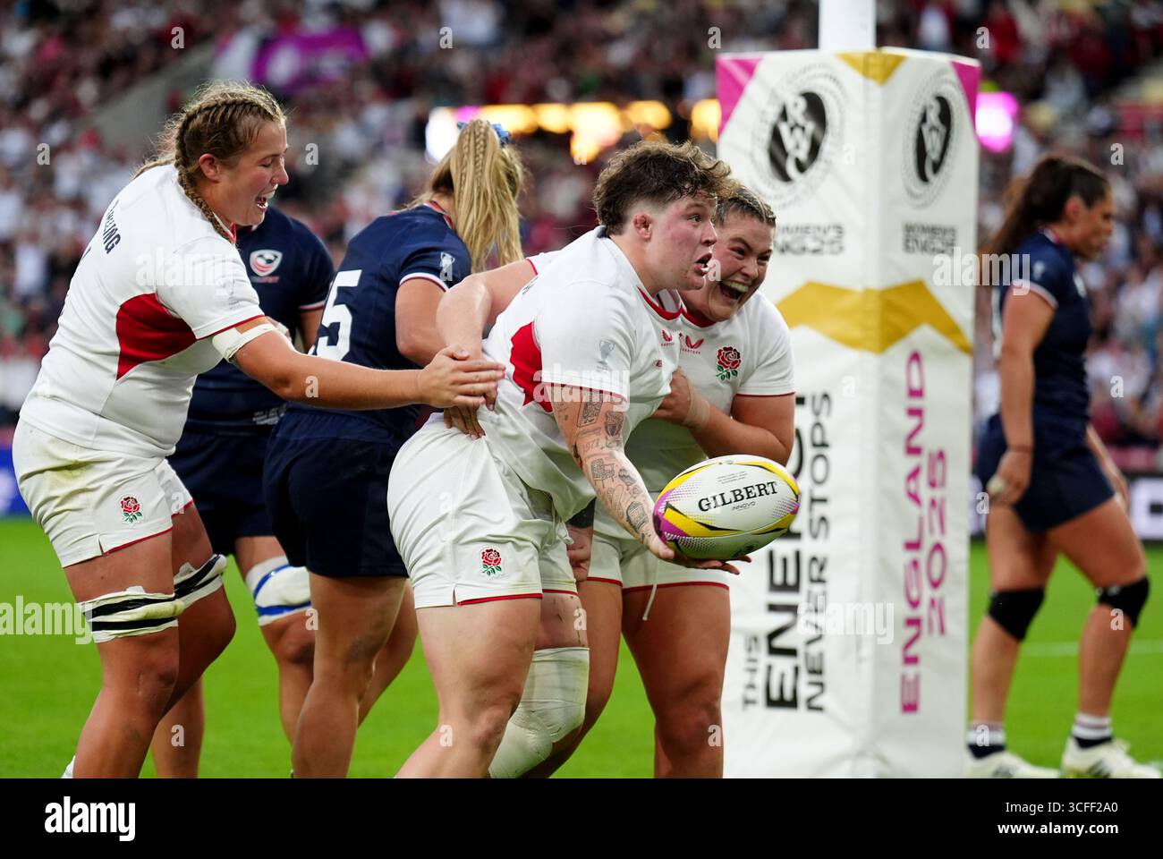 England's Hannah Botterman (centre) celebrates after scoring her sides ...