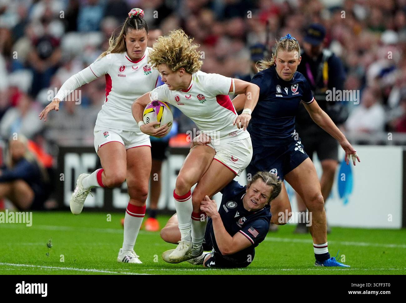 England's Ellie Kildunne (centre left) is tackled by USA's Emily ...