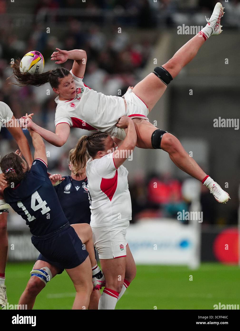 England's Abbie Ward (top) attempts to catch a high ball during the ...