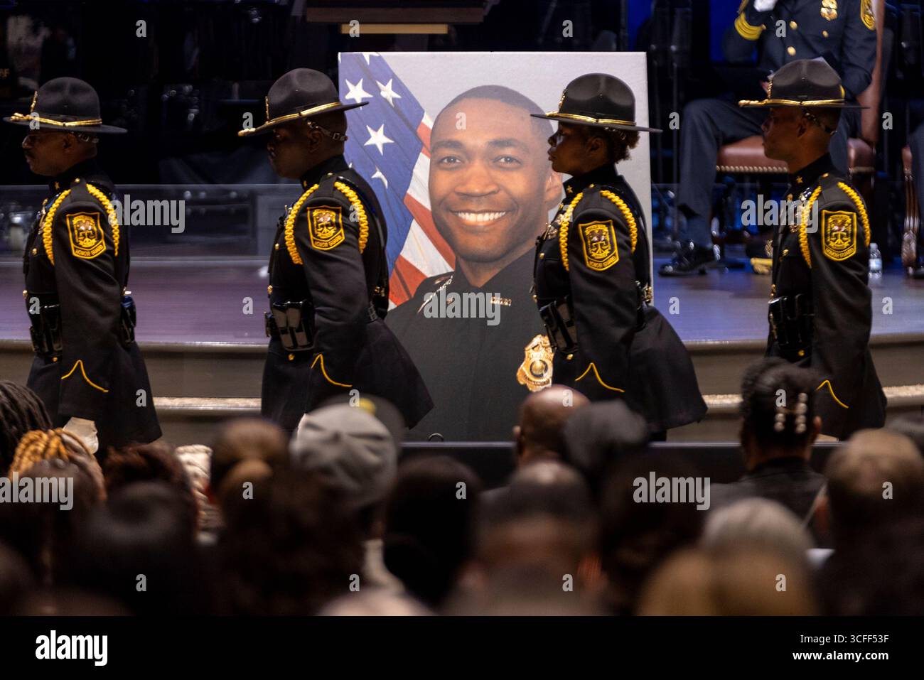Law enforcement officers march during the funeral of DeKalb County ...