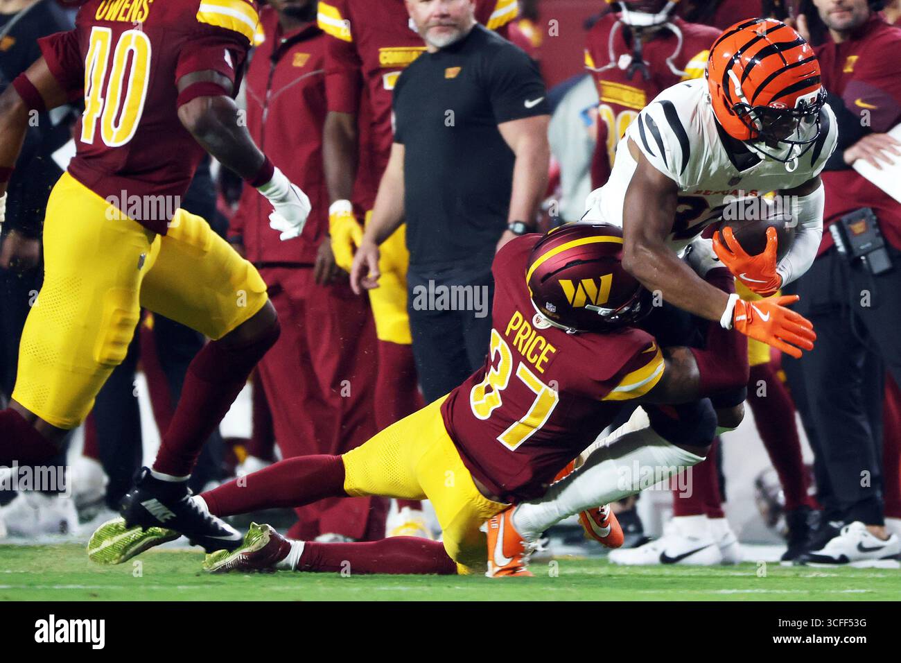 Washington Commanders cornerback Bobby Price (37) takes down Cincinnati ...