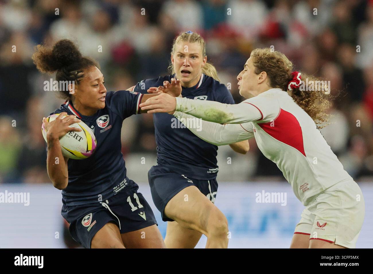 Bulou Mataitoga of the United States fends off Abby Dow of England ...