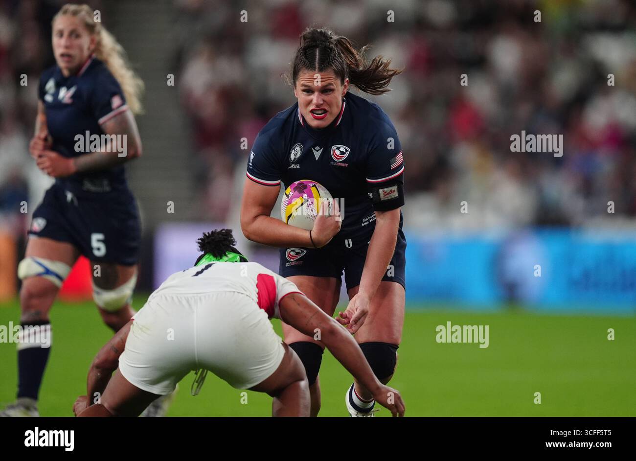 USA's Ilona Maher (top) is tackled by England's Sadia Kabeya during the ...