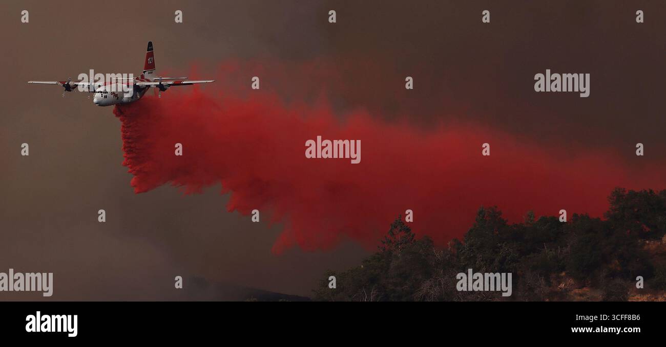 Cal Fire's tanker 121 drops on the right flank of the Pickett Fire ...