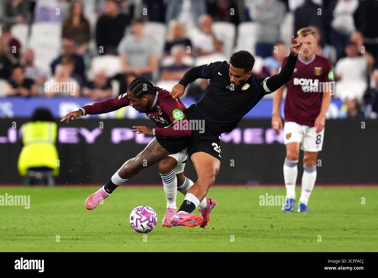 West Ham United's Kyle Walker-Peters and Chelsea's Reece James battle ...