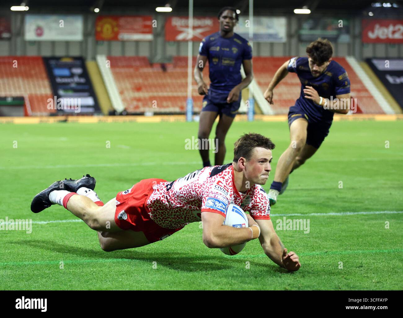 Leigh Leopards' AJ Towse scores their side's seventh try of the game ...